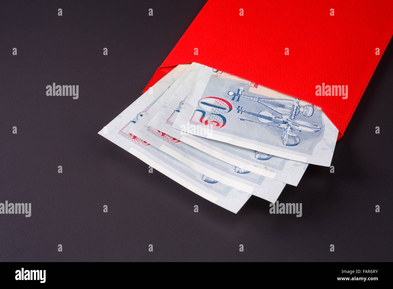 Ang pow with cash isolated on the background Stock Photo - Alamy