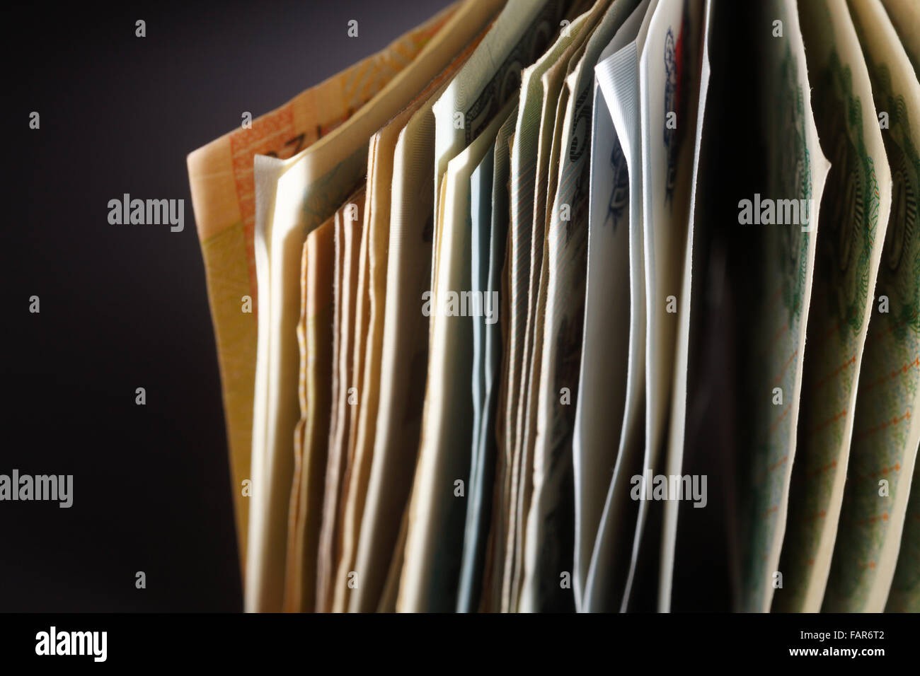 Stack of banknotes isolated on the black background Stock Photo - Alamy