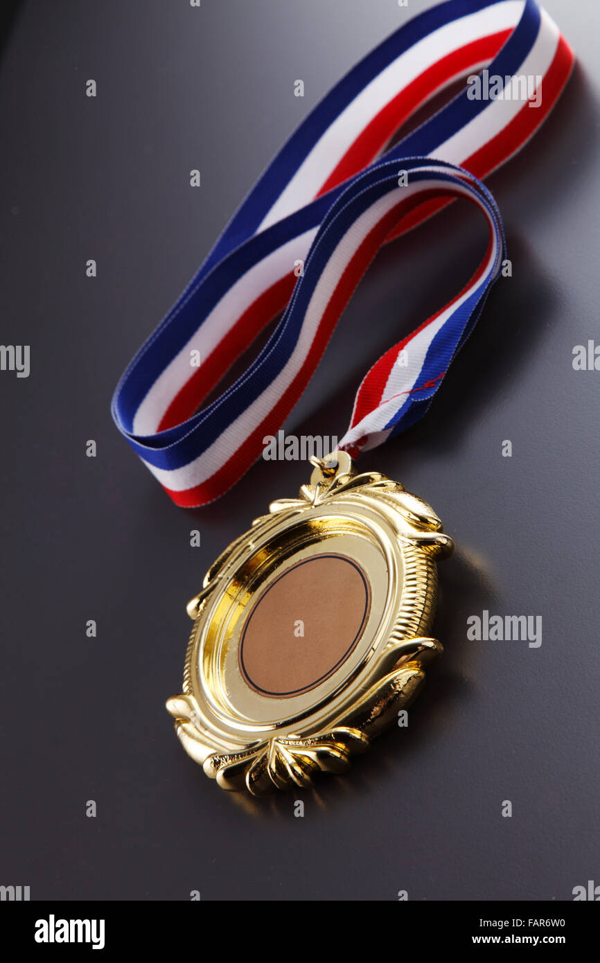 Gold medal isolated on the background Stock Photo - Alamy