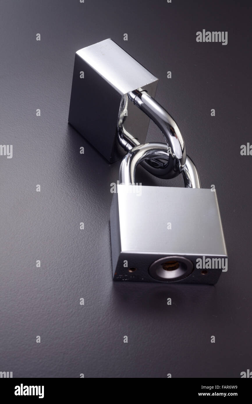 Two padlocks which are locked together Stock Photo - Alamy