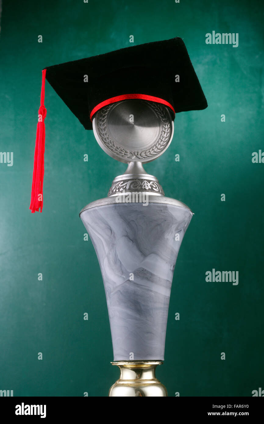 Graduation hat on the silver trophy Stock Photo - Alamy