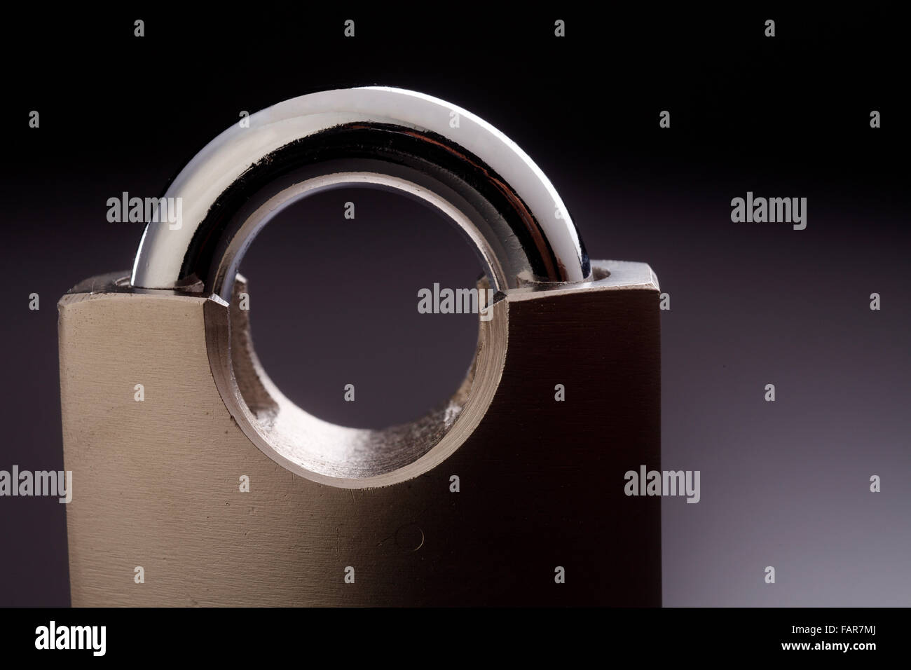 Padlock isolated on black background Stock Photo - Alamy