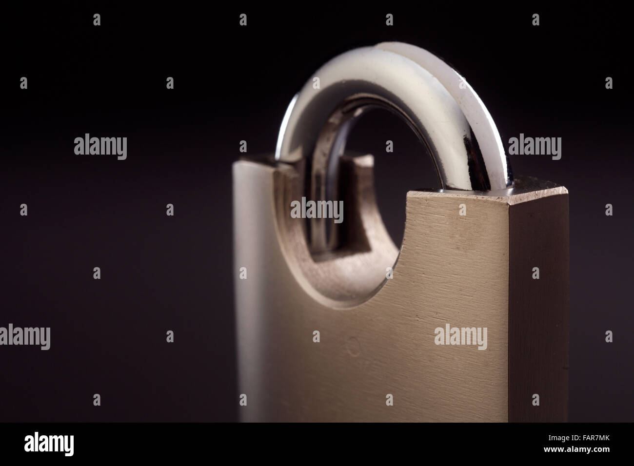 Padlock isolated on black background Stock Photo - Alamy