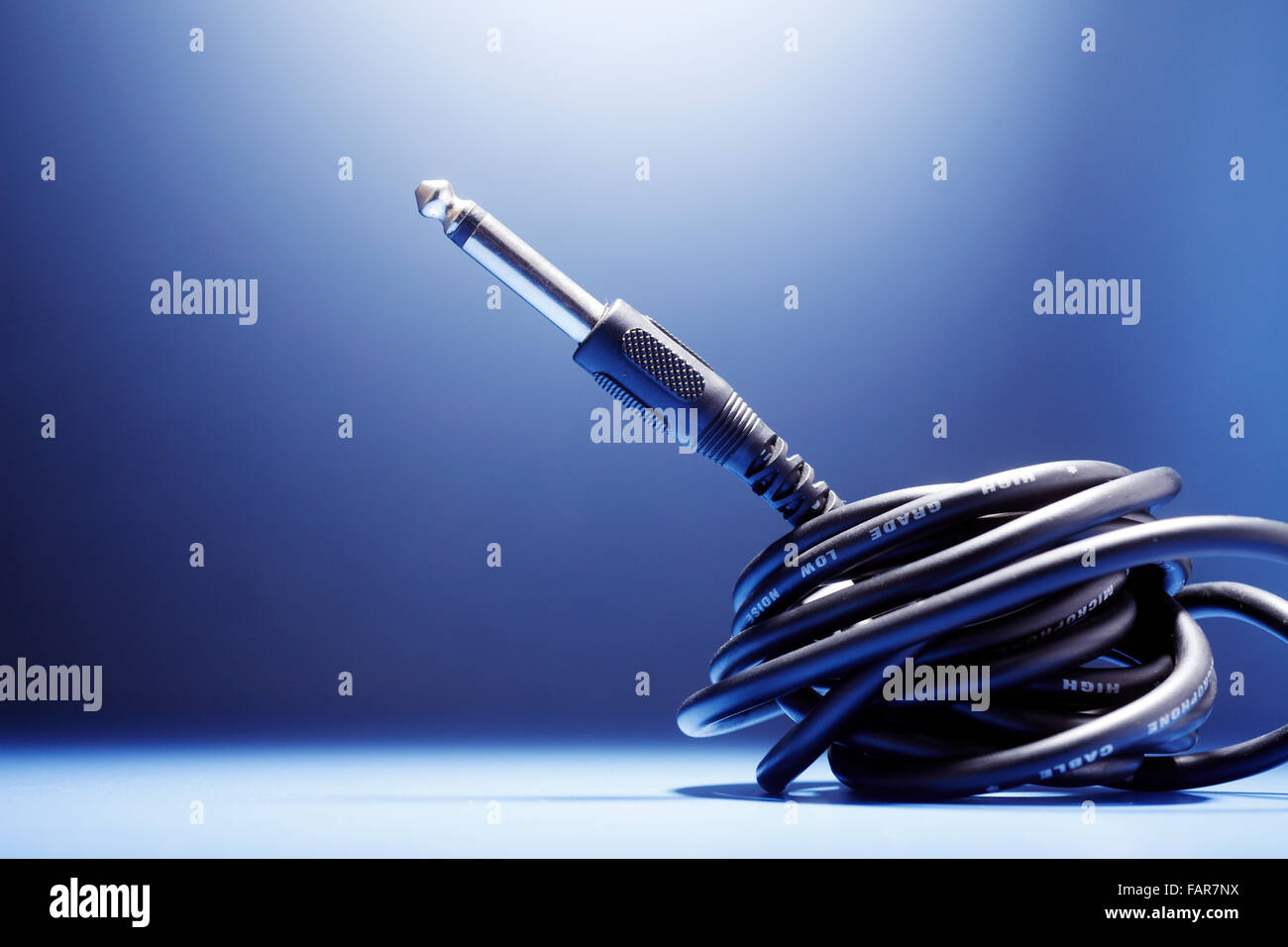 Stock image of an audio jack rolled up Stock Photo - Alamy