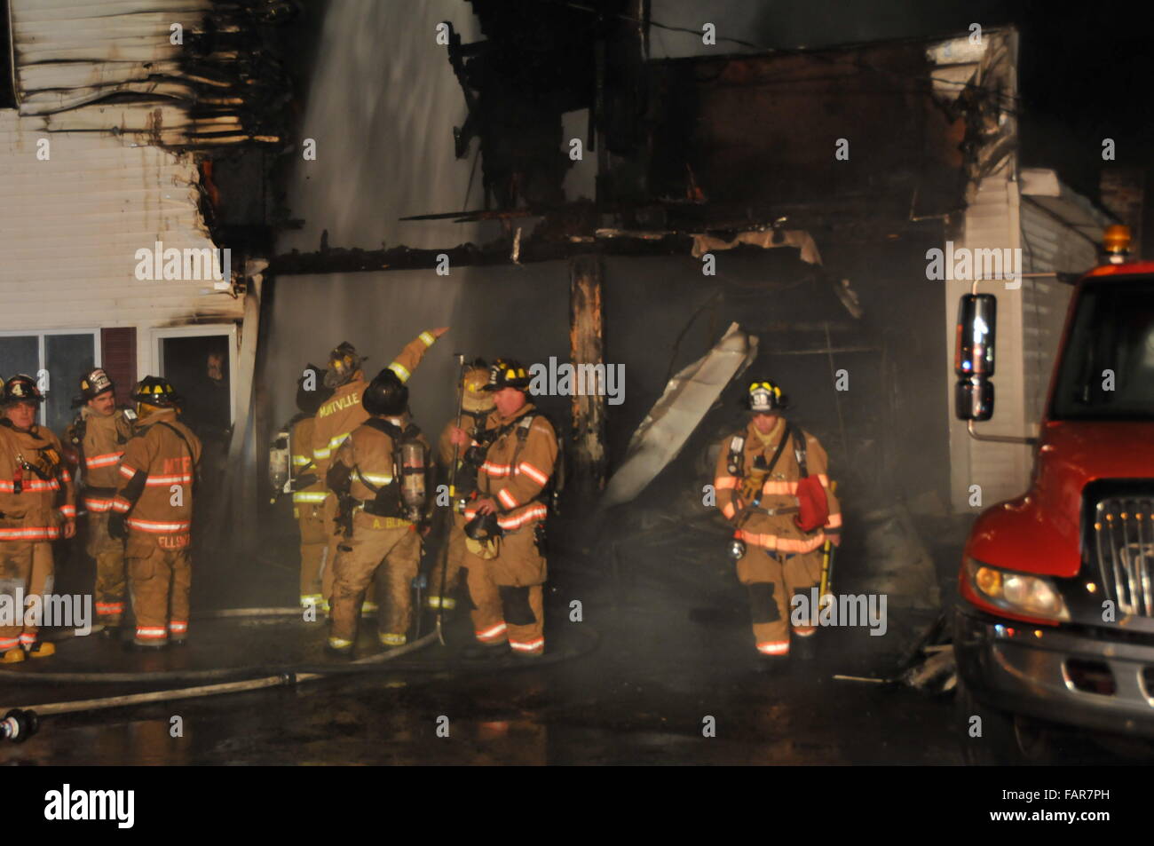 A chief directs an aerials master stream on a structure fire Stock ...