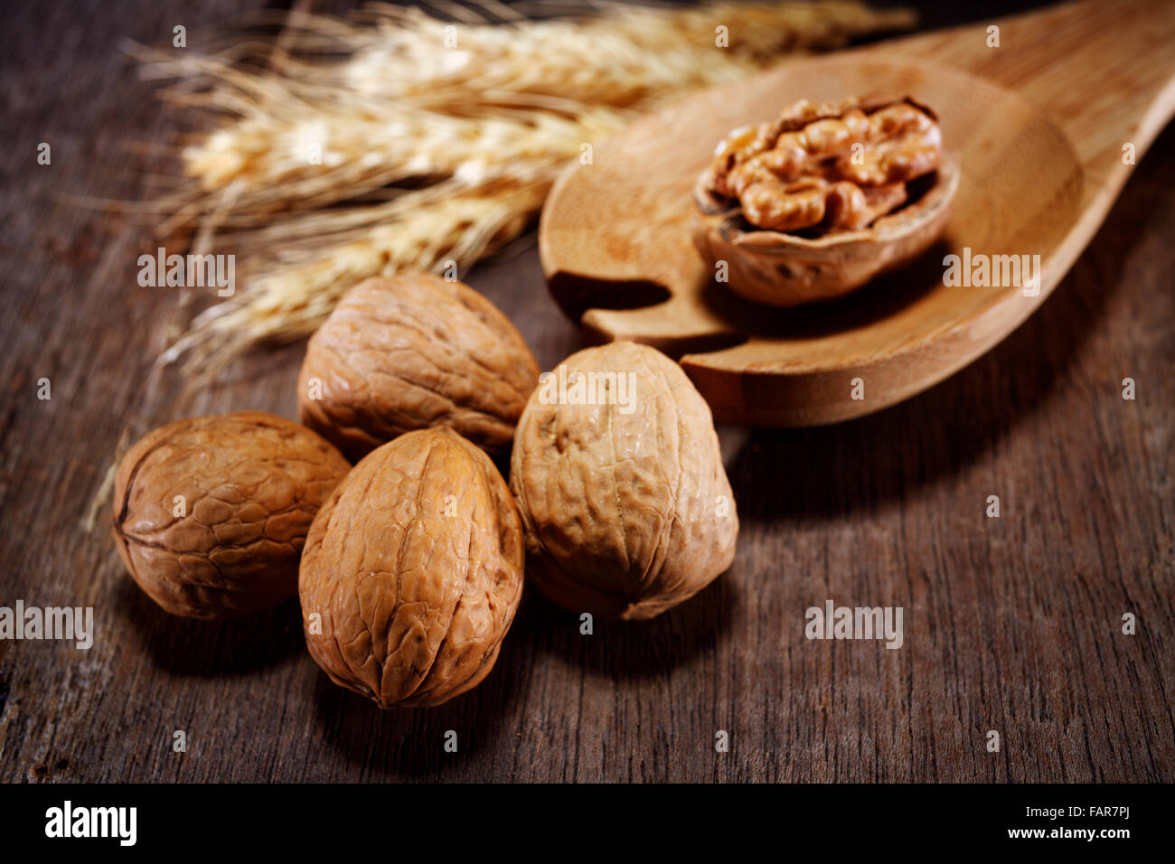Walnuts wooden spoon wheat hi-res stock photography and images - Alamy
