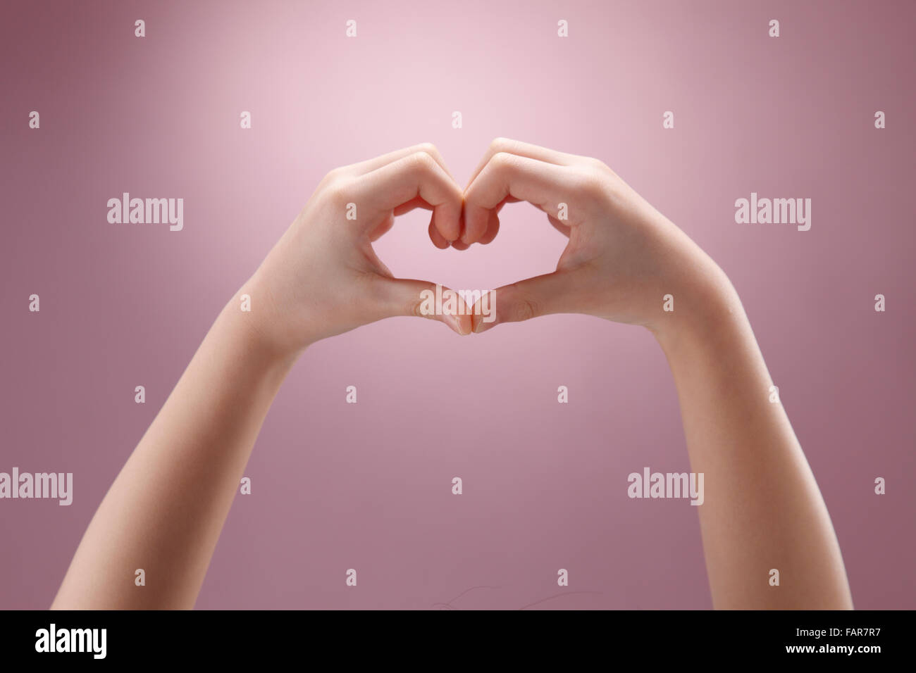 Human hand forming a love symbol Stock Photo - Alamy