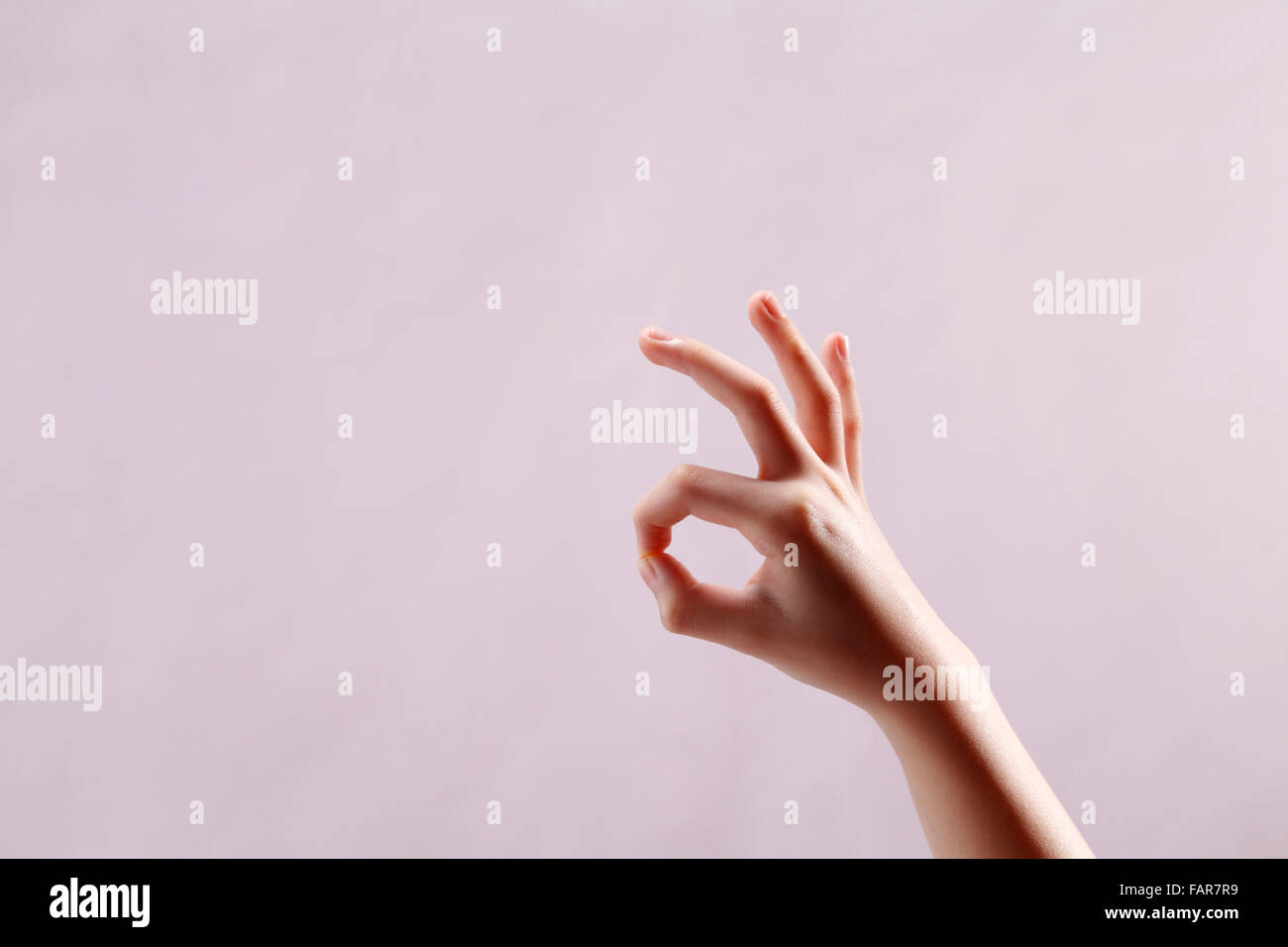 Human hand showing an ok sign Stock Photo - Alamy