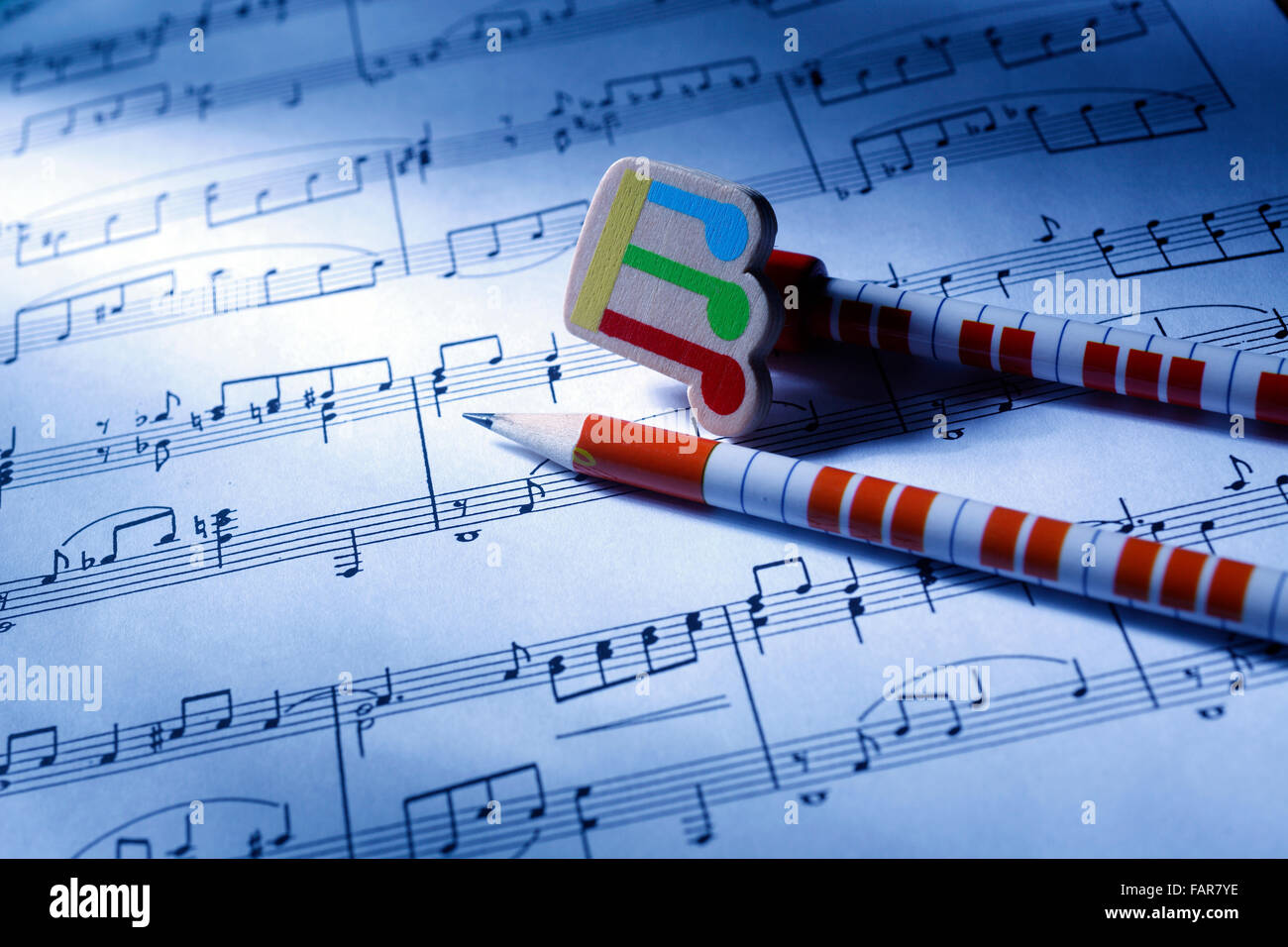 stock image of Pencil resting on the musical note Stock Photo - Alamy