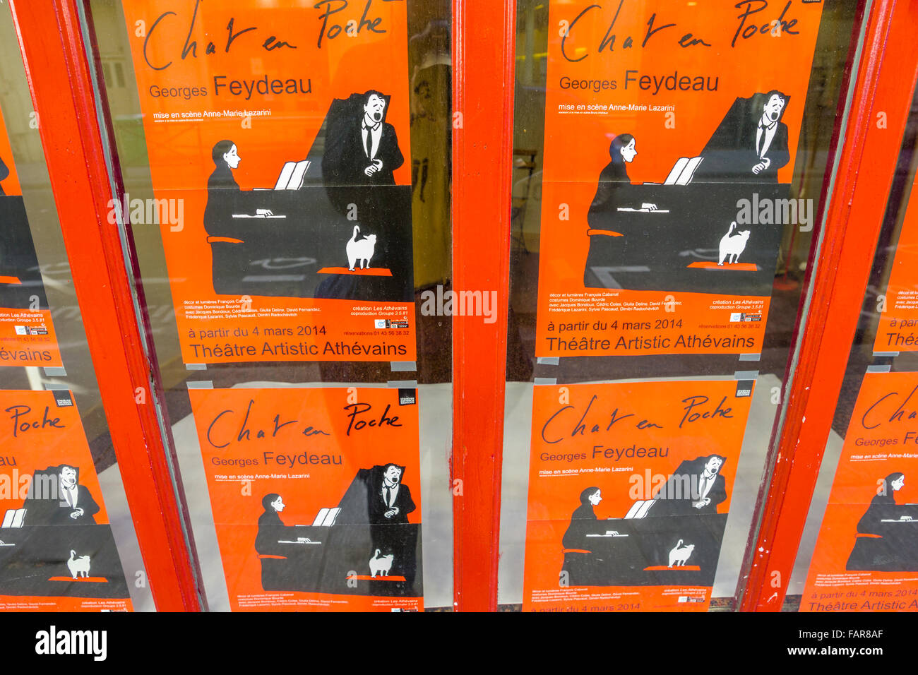 posters in store window, Paris Stock Photo - Alamy