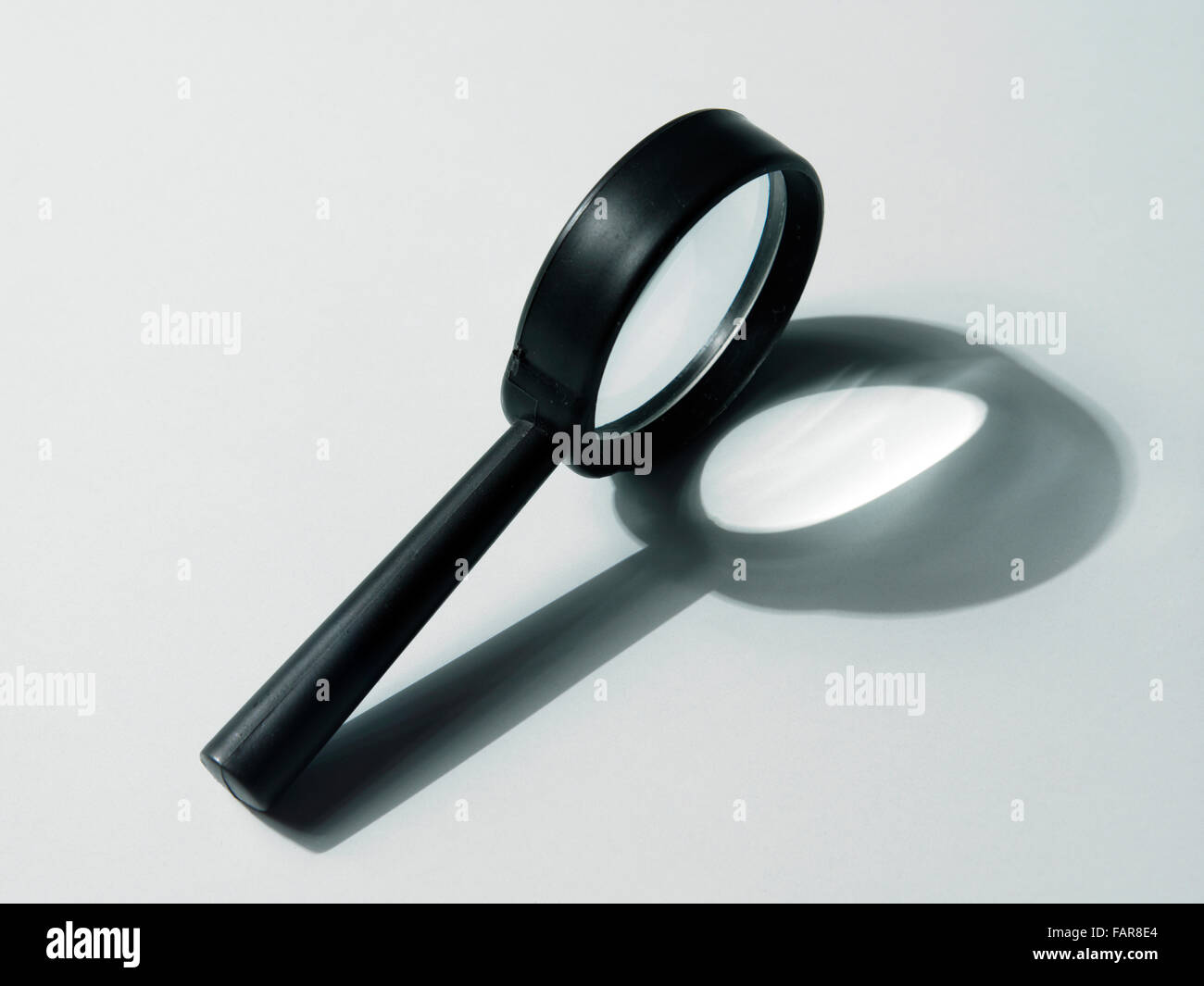 close up of the magnifying glass on the plain background Stock Photo ...