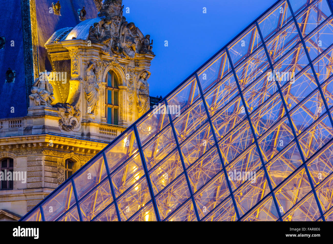 Louvre Museum main entrance at dusk, Paris Stock Photo - Alamy