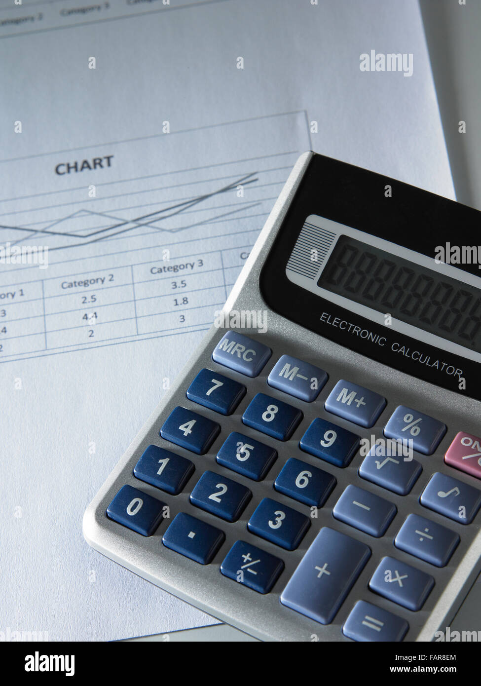 chart and calculator on the table Stock Photo - Alamy