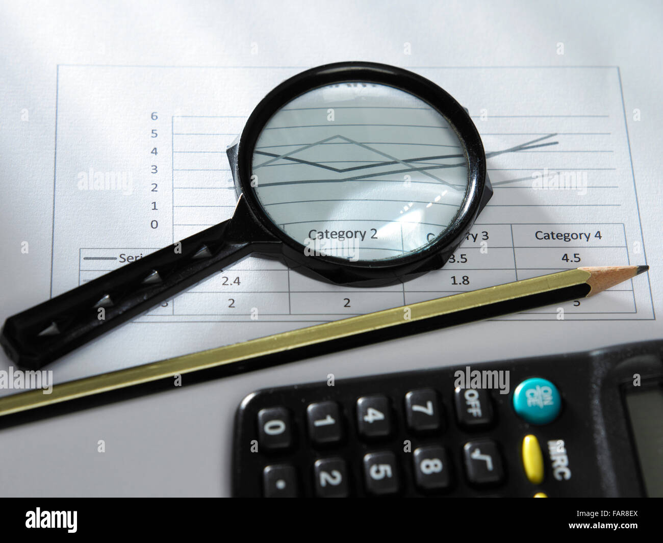 chart and calculator on the table Stock Photo - Alamy