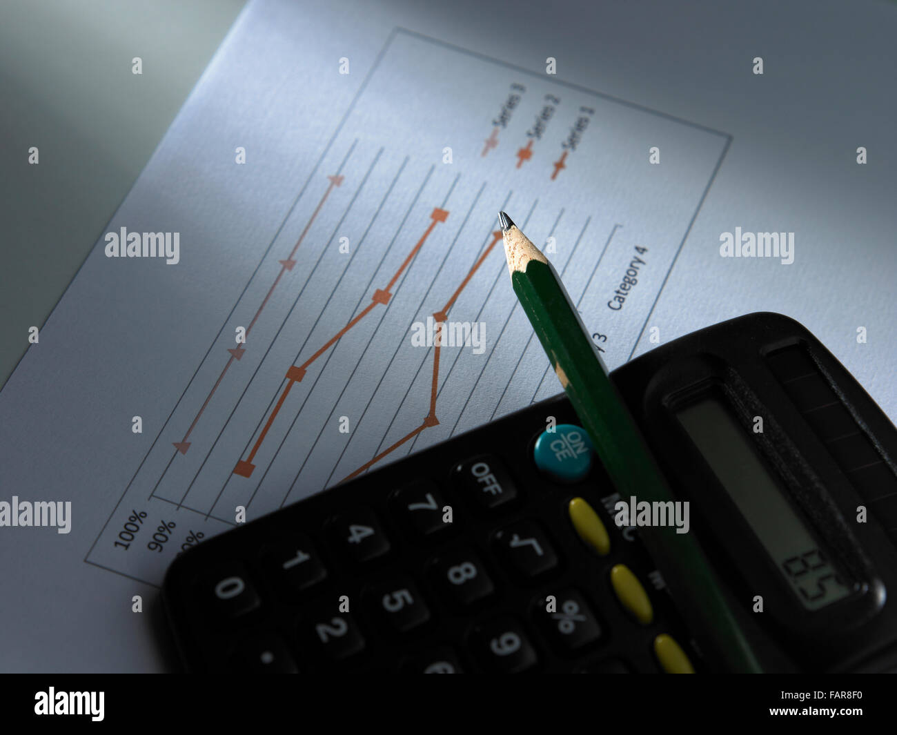 chart and calculator on the table Stock Photo - Alamy