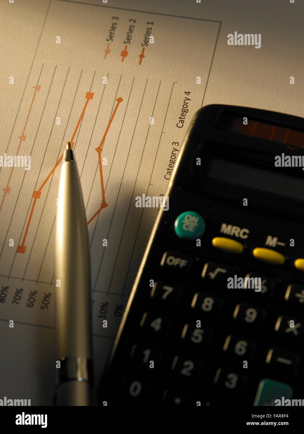 chart and calculator on the table Stock Photo - Alamy