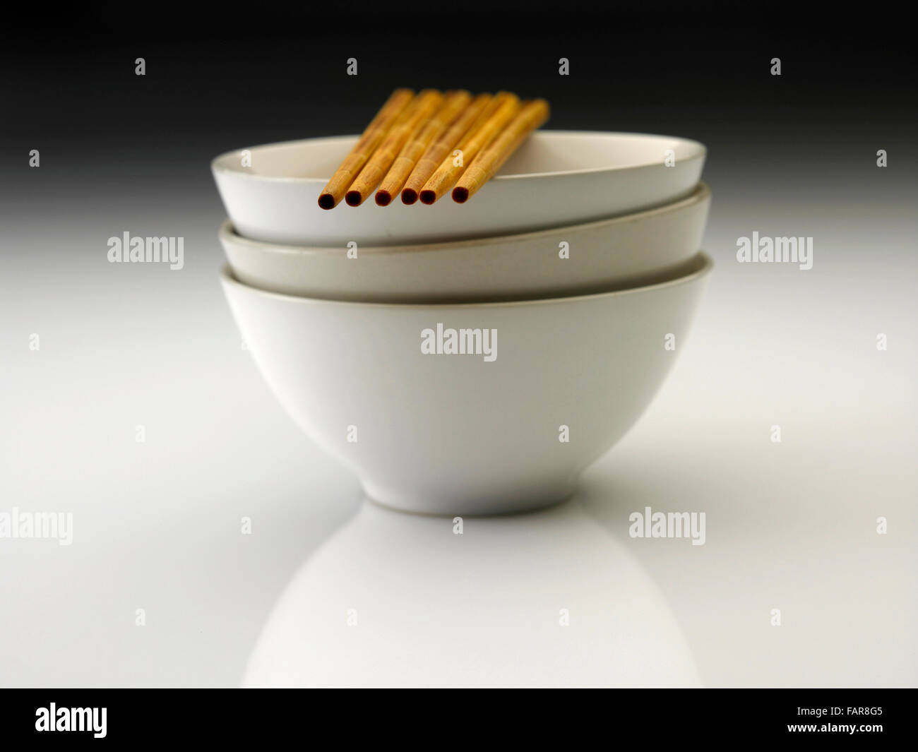 chockstick rest on the bowls on the plain background Stock Photo - Alamy