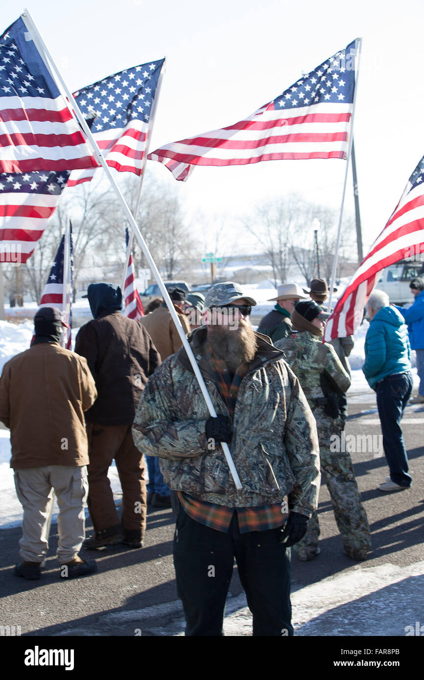 Burns, Oregon, USA. 02nd Jan, 2016. Man Holds American Flag at Rally ...