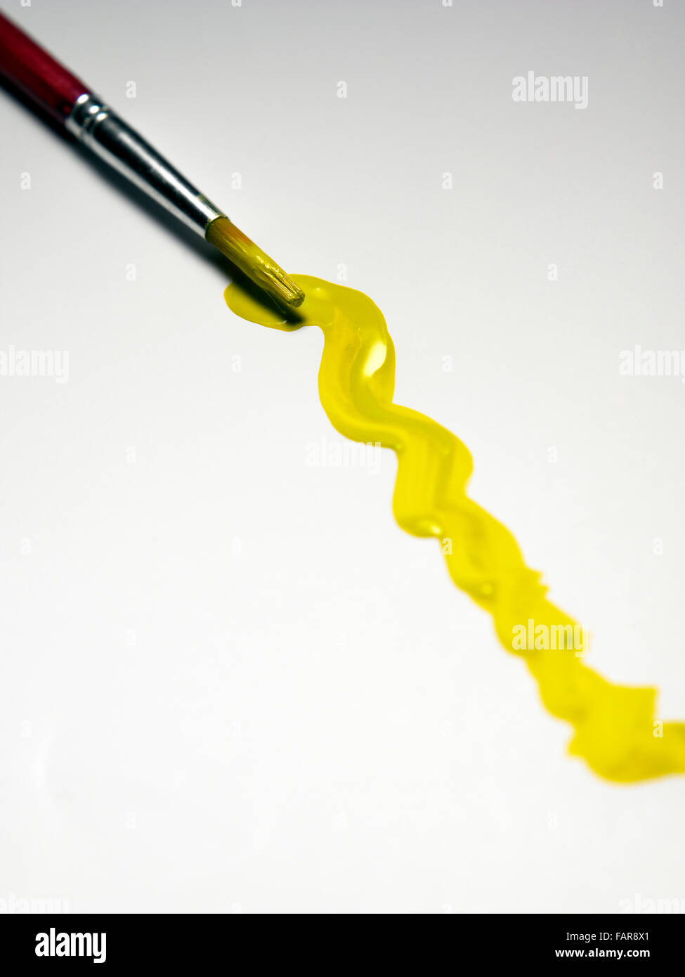 paint brush with yellow color Stock Photo - Alamy