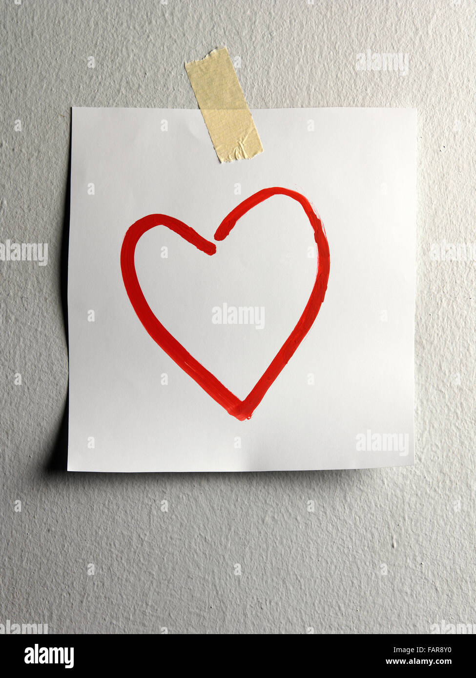 paper painted with heart shape stick on the wall Stock Photo - Alamy