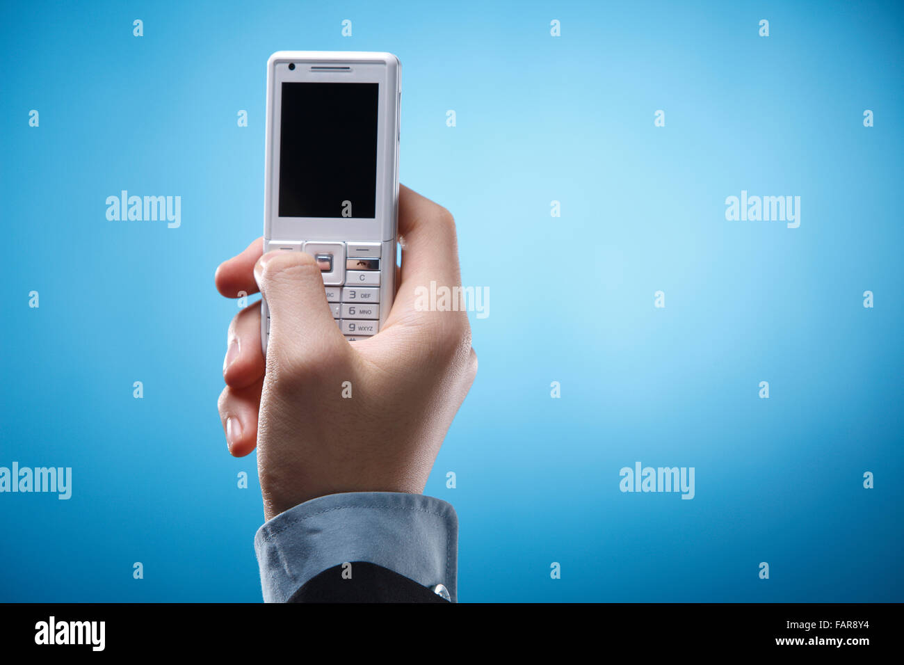 Human hand holding a cell phone Stock Photo - Alamy