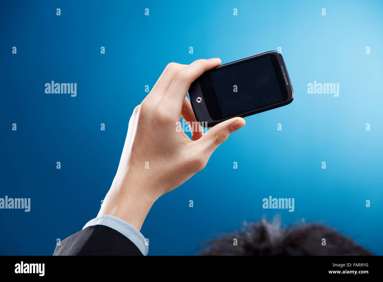 Human hand holding a smart phone Stock Photo - Alamy