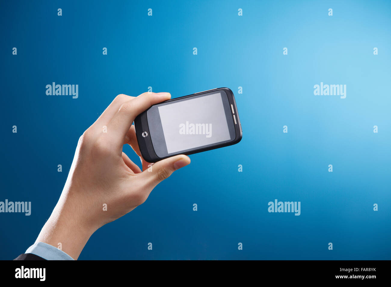 Human hand holding a smart phone Stock Photo - Alamy