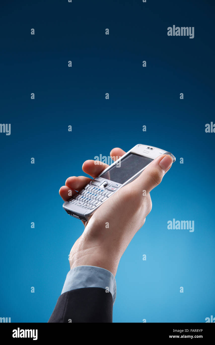 Human hand holding a cell phone Stock Photo - Alamy