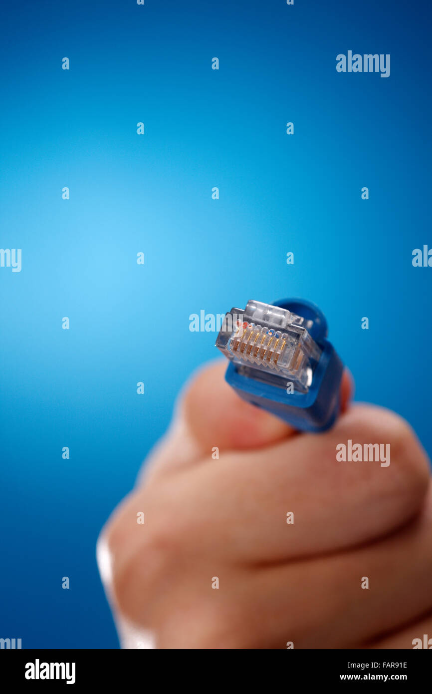 Human hand holding an Internet connection cable Stock Photo - Alamy