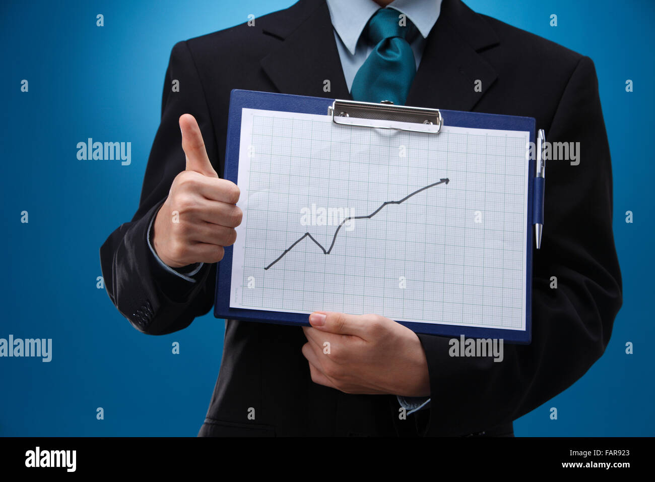 Human holding a graph attached to a clipboard Stock Photo - Alamy