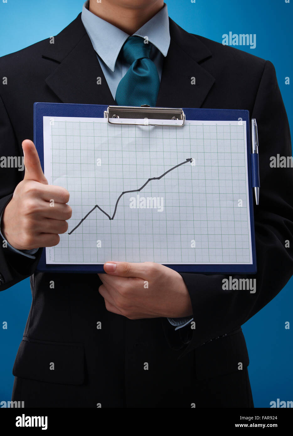 Human holding a graph attached to a clipboard Stock Photo - Alamy