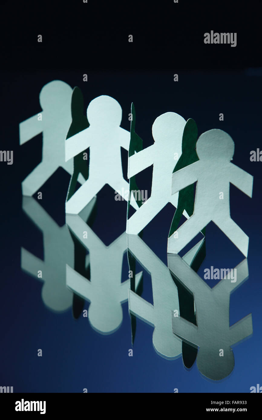 Paper chain isolated on the blue background Stock Photo - Alamy