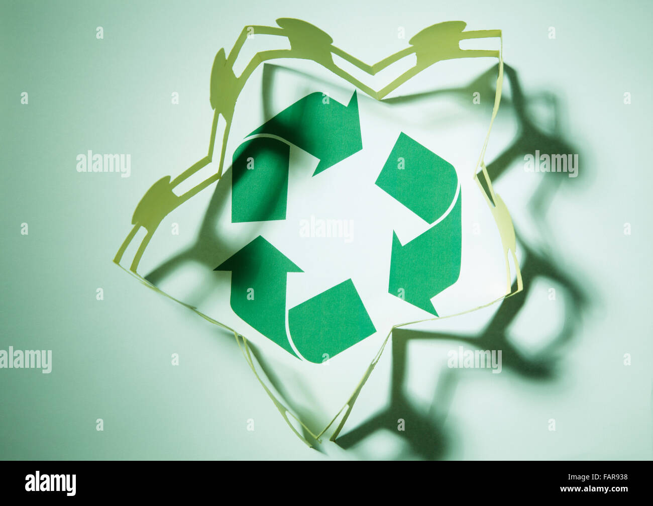 Paper chain surrounding the recycle symbol Stock Photo - Alamy