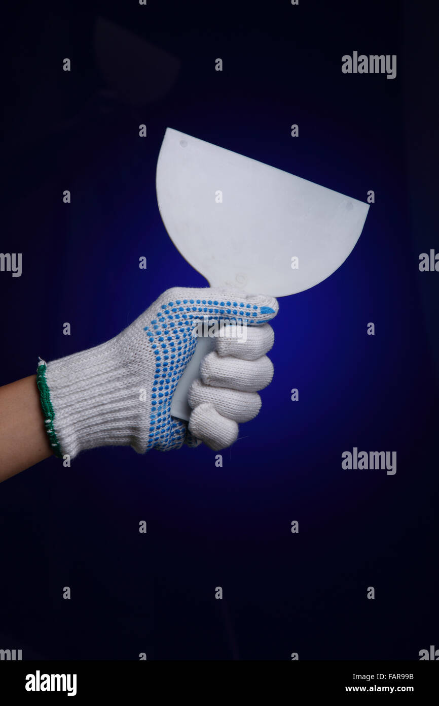 stock image of the man holding a scraper Stock Photo - Alamy