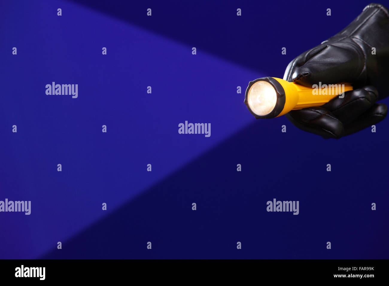 male hand holding lit flashlight at night Stock Photo - Alamy