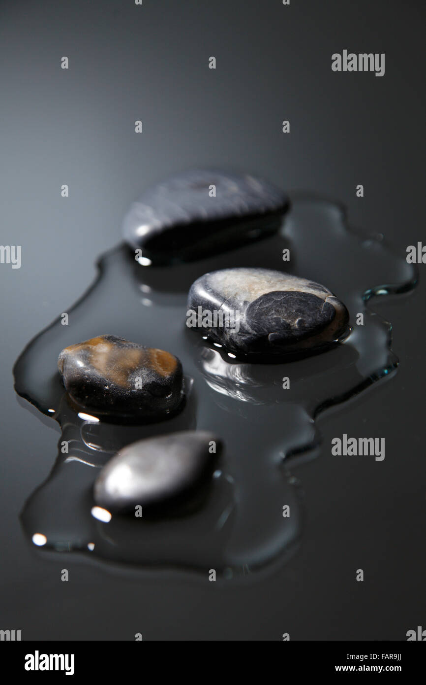 stone and water on the gray background Stock Photo - Alamy