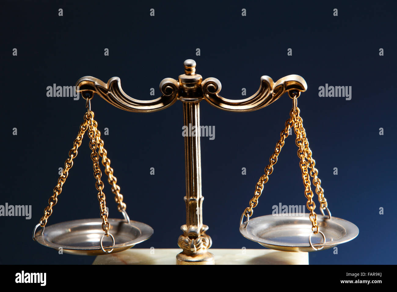 Balance scale isolated on the blue background Stock Photo - Alamy