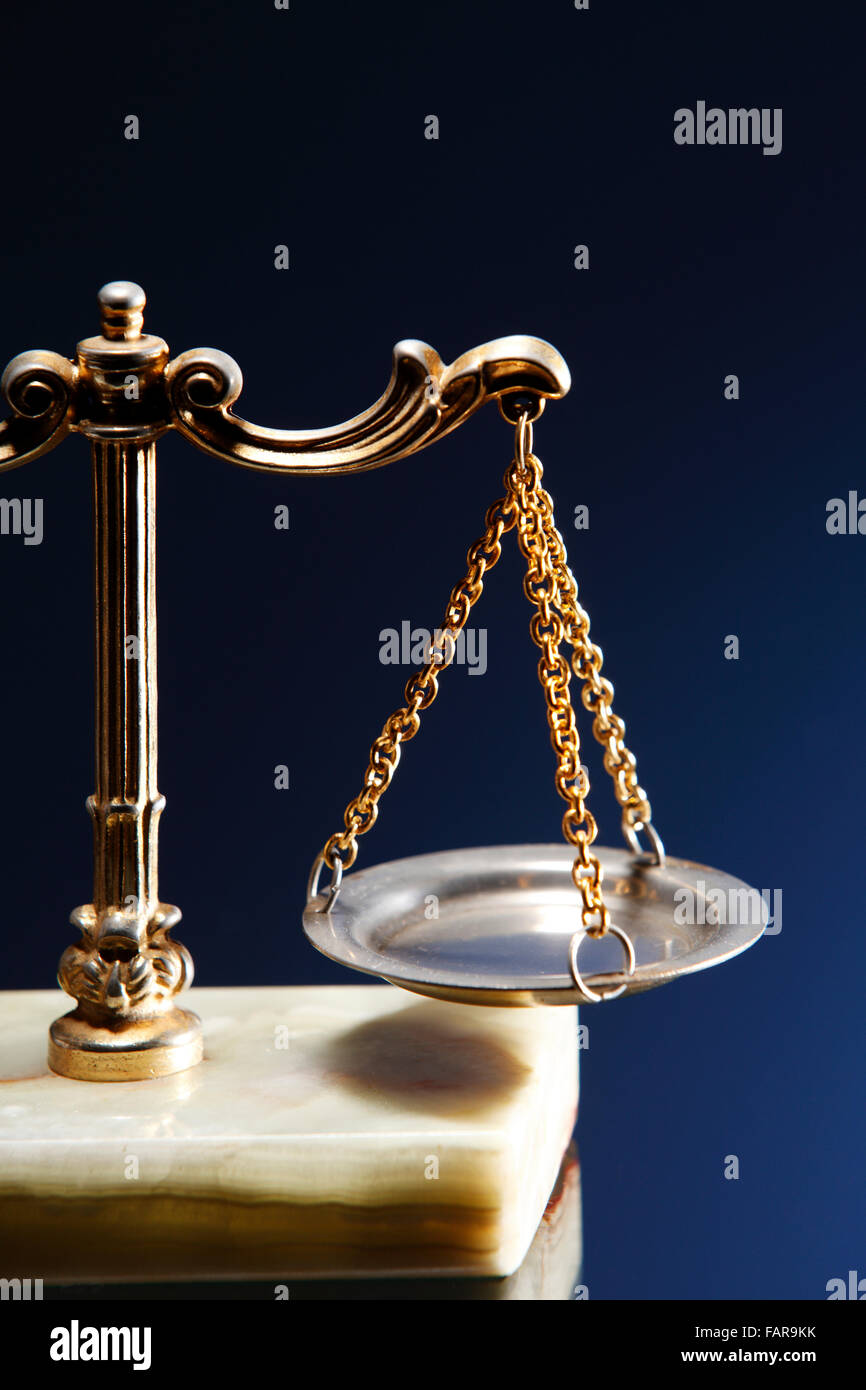 Balance scale isolated on the blue background Stock Photo - Alamy