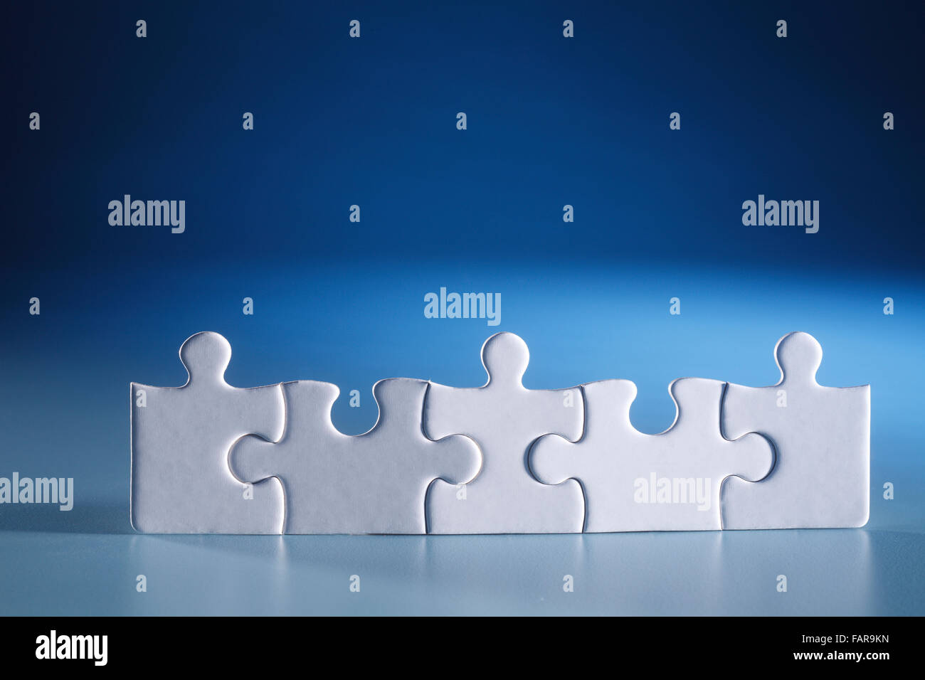 Five puzzle pieces arranged together Stock Photo - Alamy