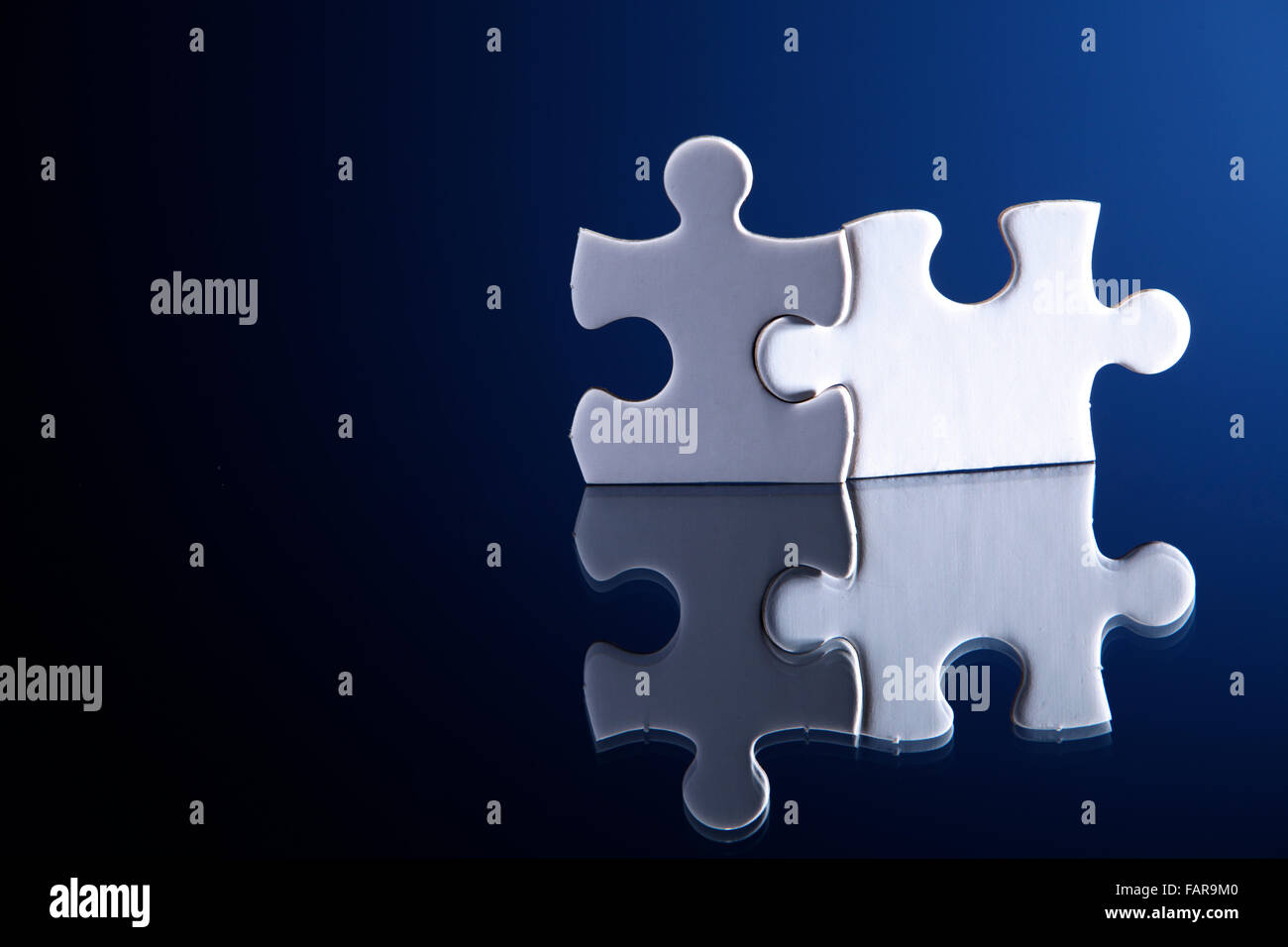Bonding of two puzzle pieces Stock Photo - Alamy