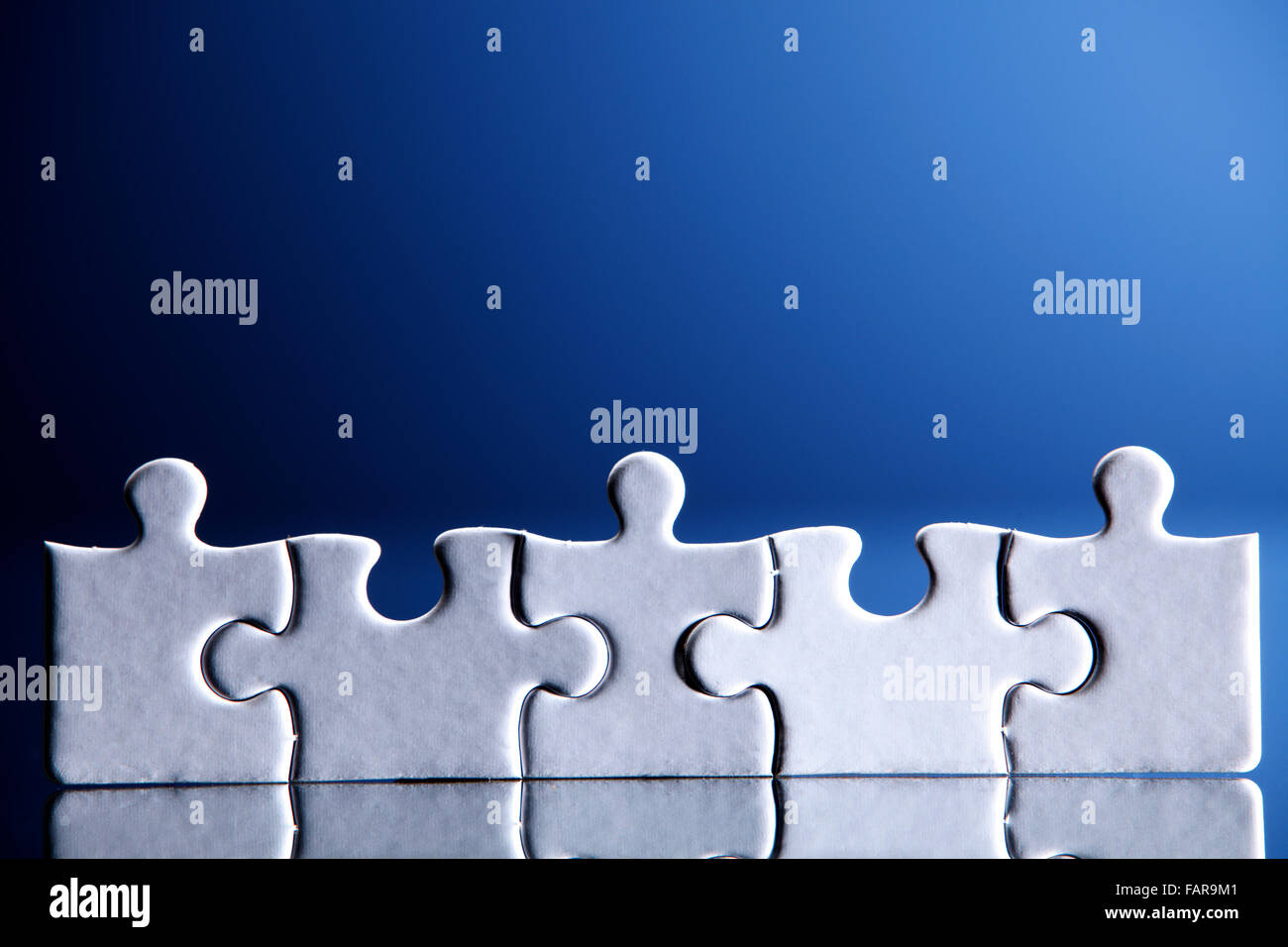 Five puzzle pieces arranged together Stock Photo - Alamy