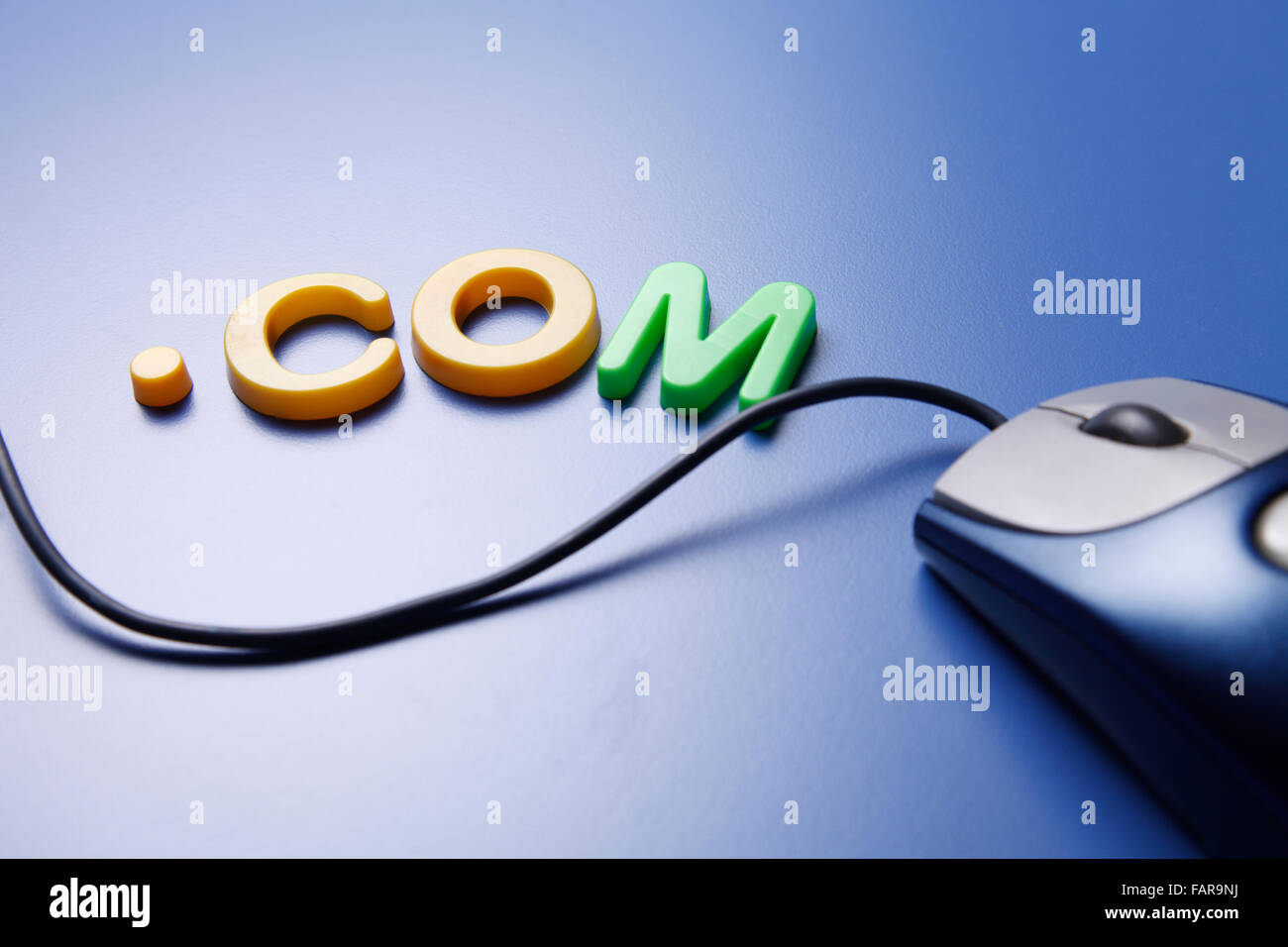 Mouse with magnetic letters isolated on the blue background Stock Photo ...