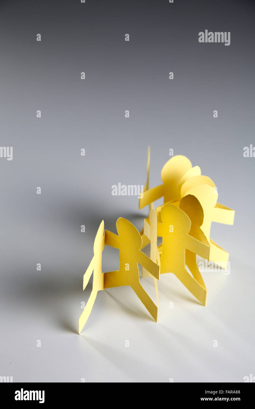 Paper chain isolated on the grey background Stock Photo - Alamy