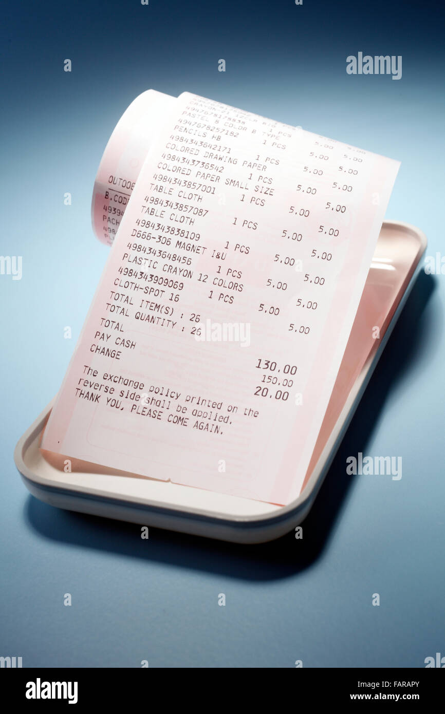 Reciept on a white tray Stock Photo - Alamy