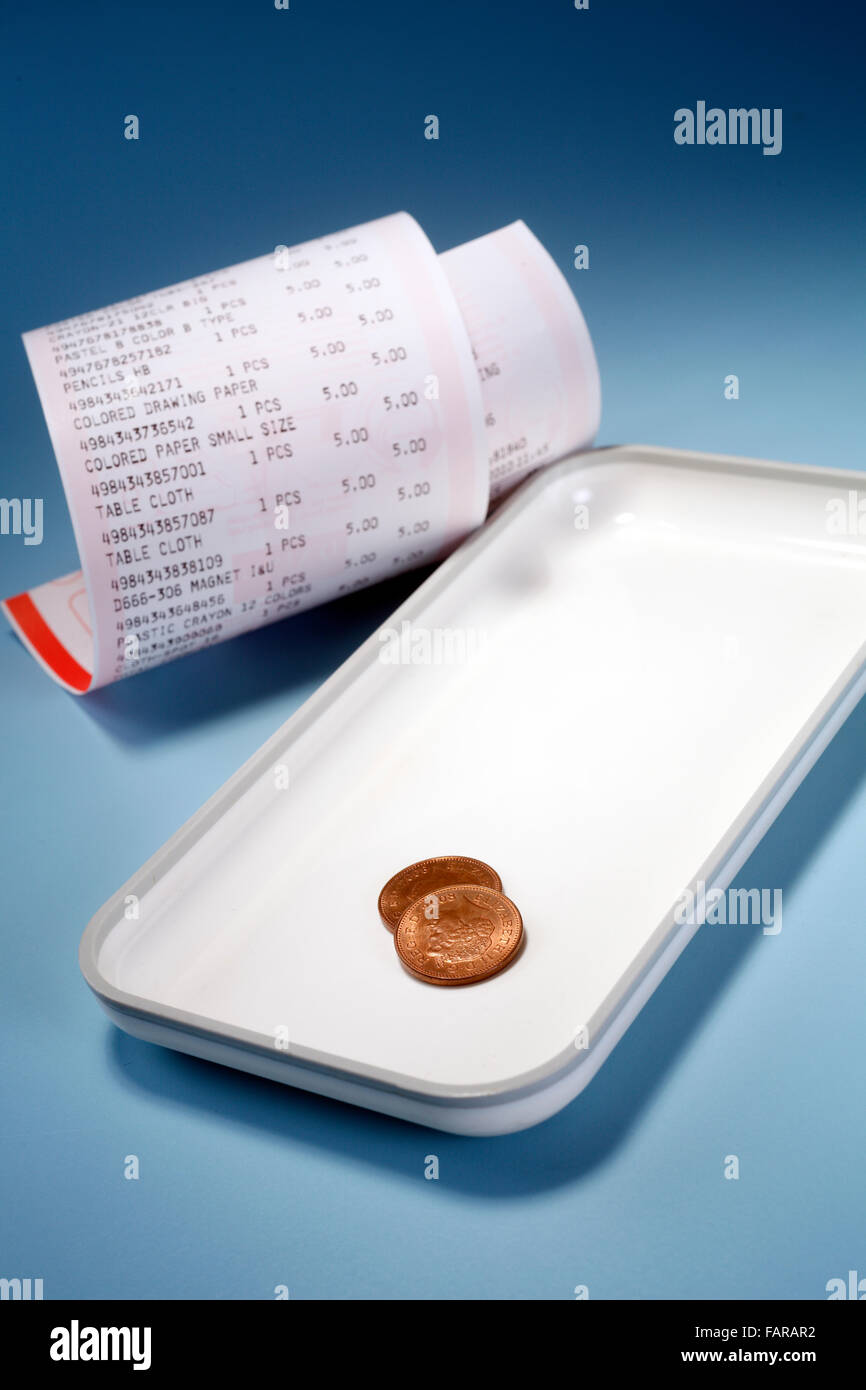 Reciept and tray isolated on blue background Stock Photo - Alamy