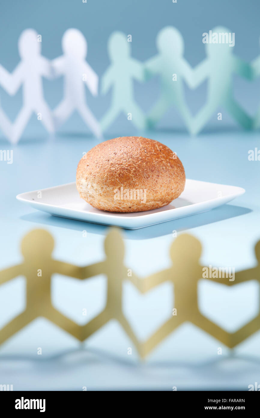 Paper chain surrounding a bread Stock Photo - Alamy