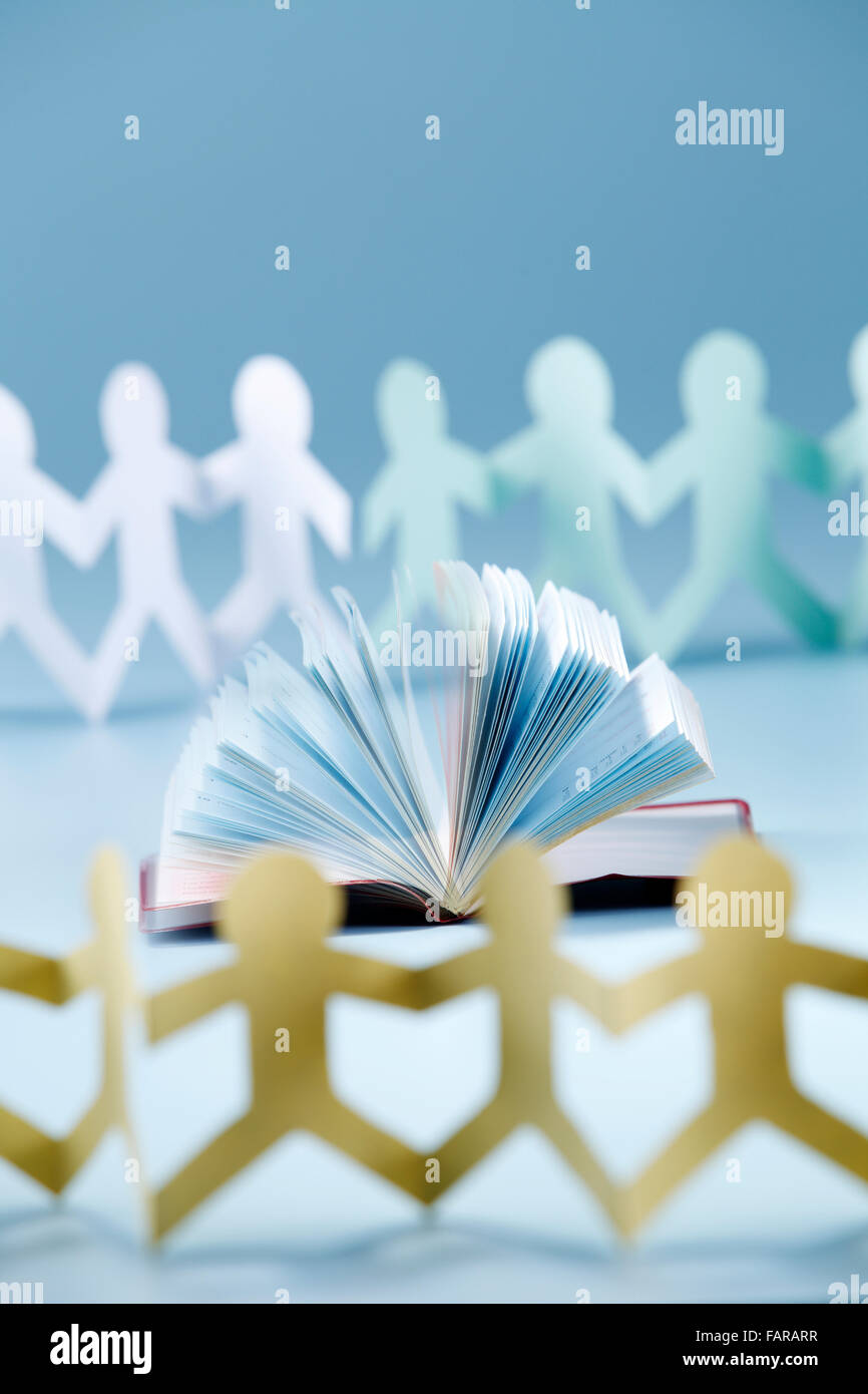 Paper chain surrounding a notebook Stock Photo - Alamy