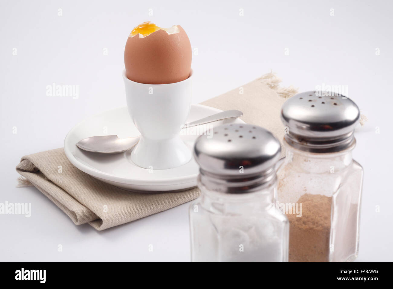 Half boiled egg with salt and pepper Stock Photo - Alamy