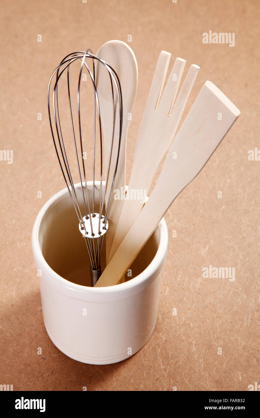 Baking utensils arranged in a cup isolated on the background Stock ...