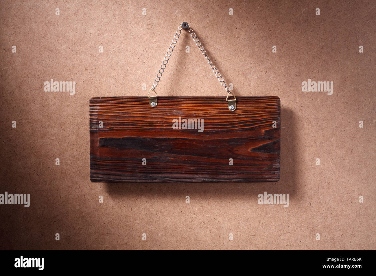 Glossy wood sign hung on background Stock Photo - Alamy